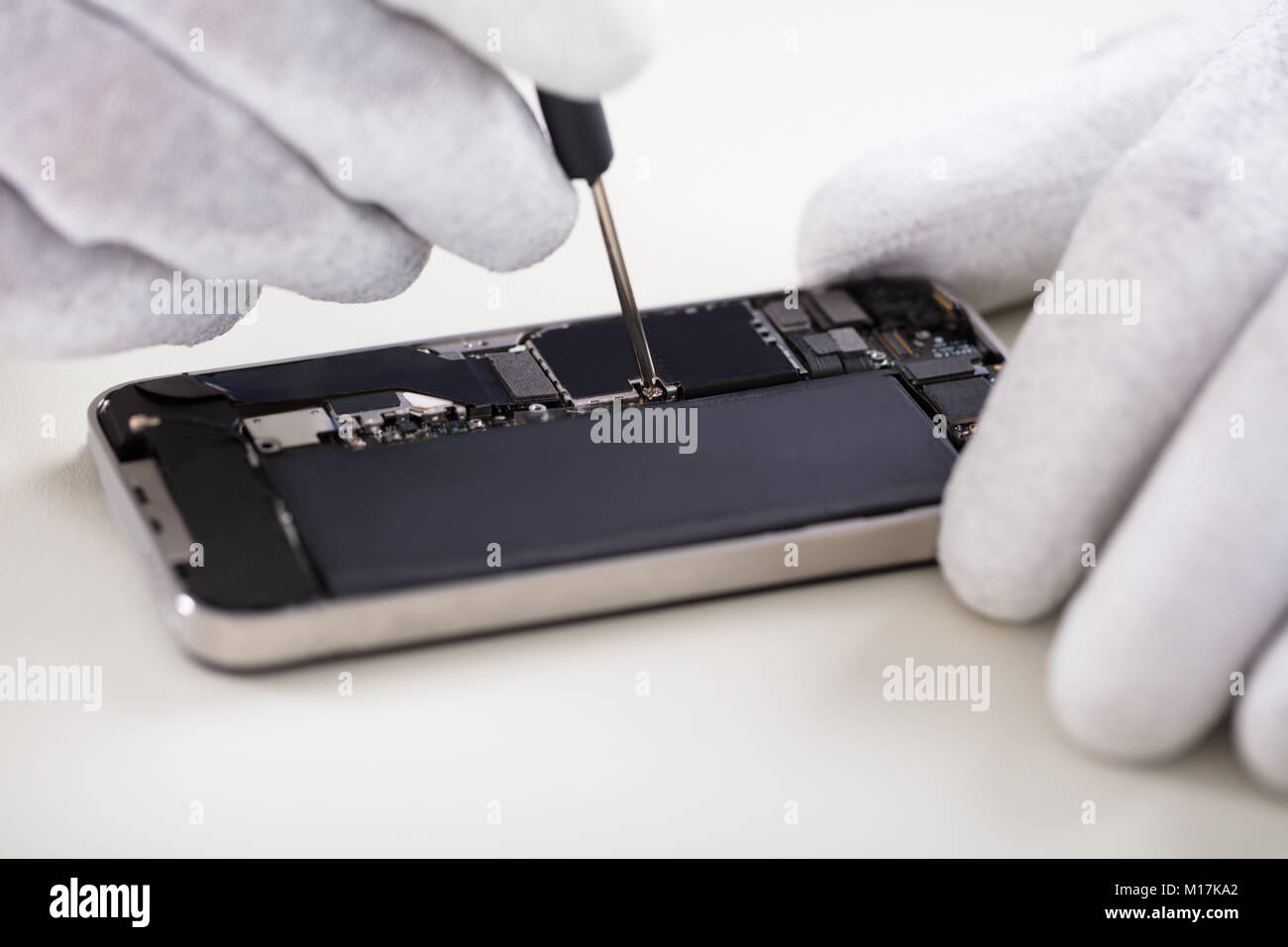 Close-up Of A Human Hand Repairing Smartphone With Screwdriver Stock ...