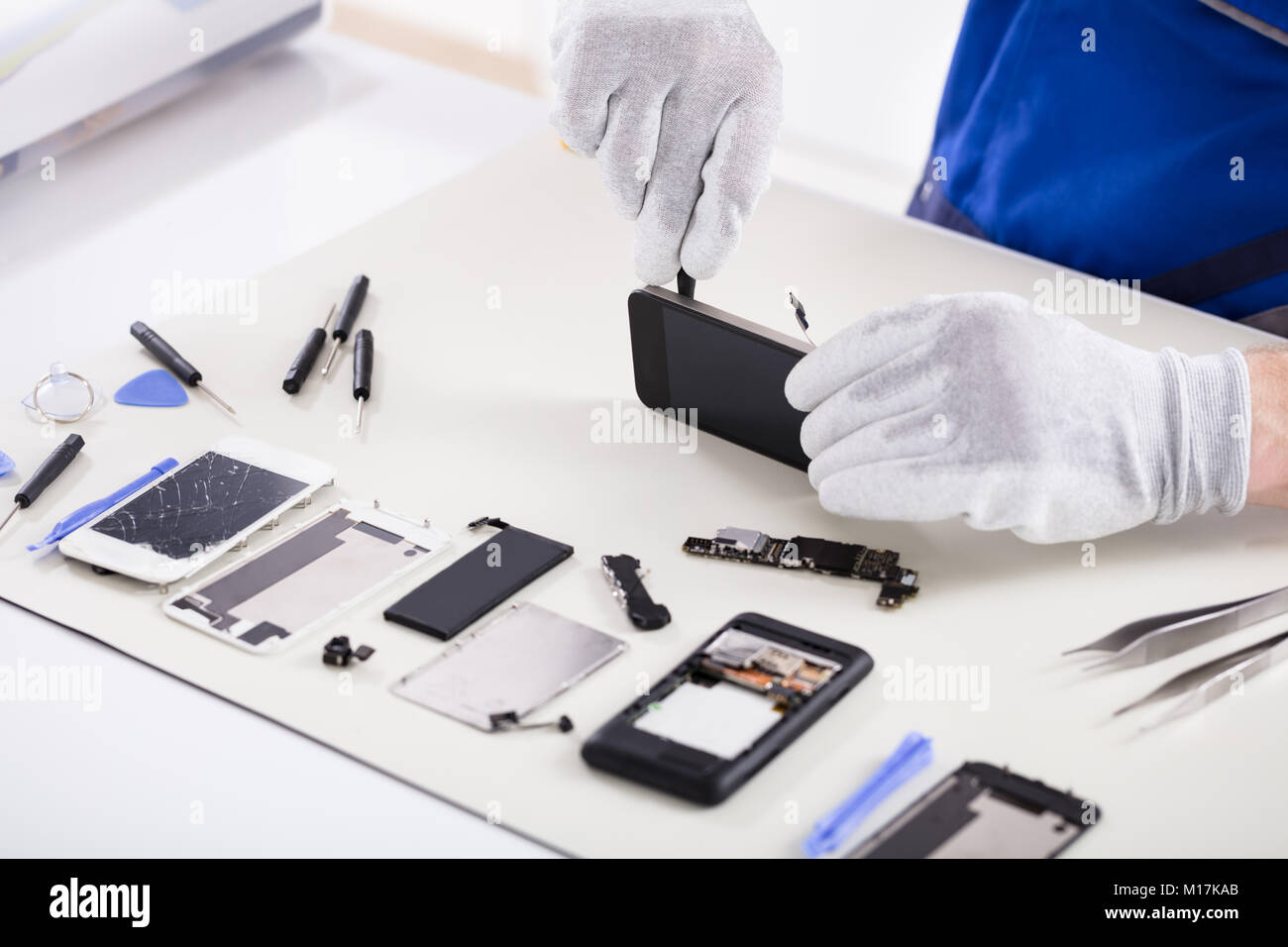 Close-up Of A Human Hand Repairing Smartphone With Screwdriver Stock ...