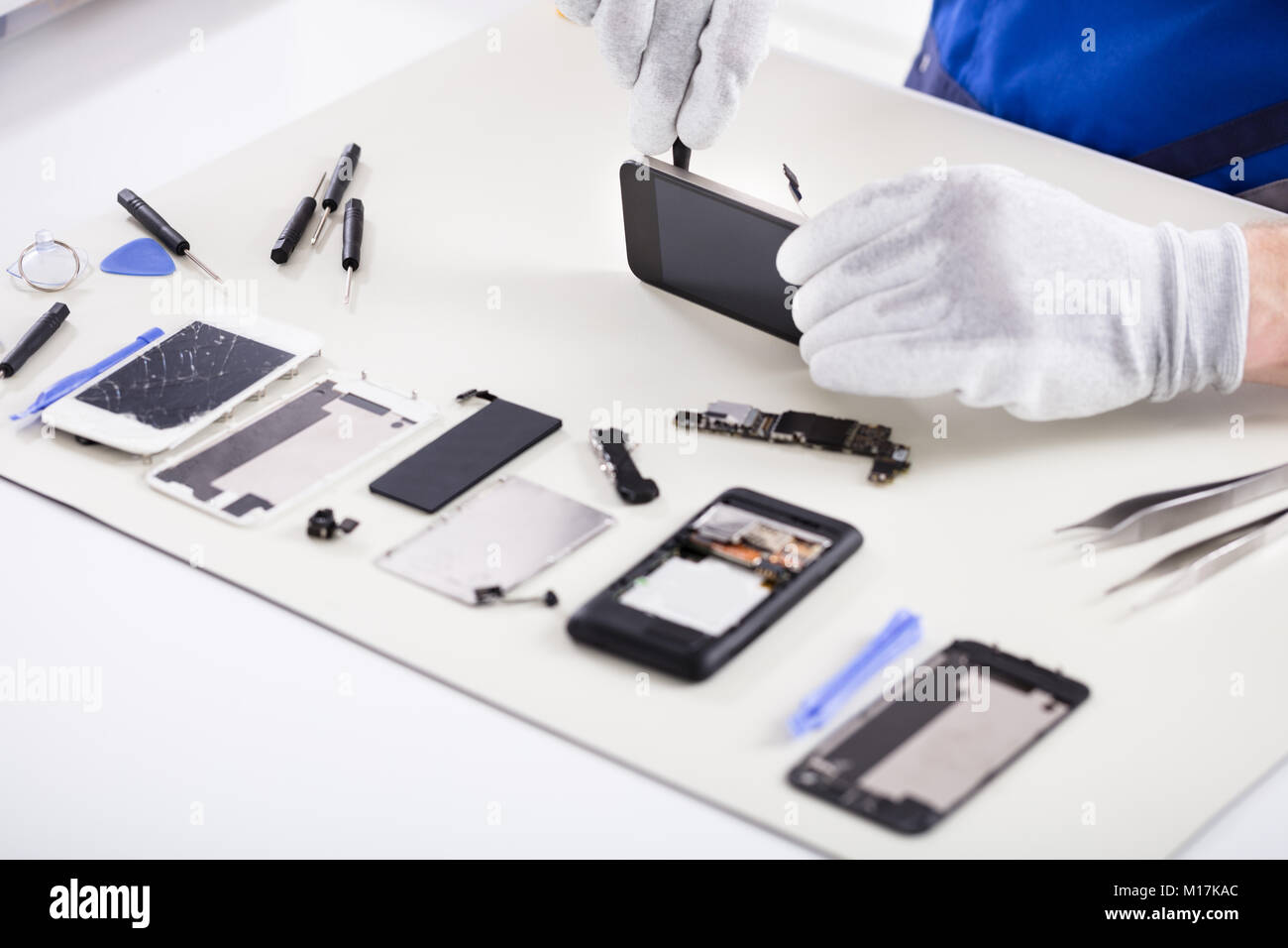 Close-up Of A Human Hand Repairing Smartphone With Screwdriver Stock ...