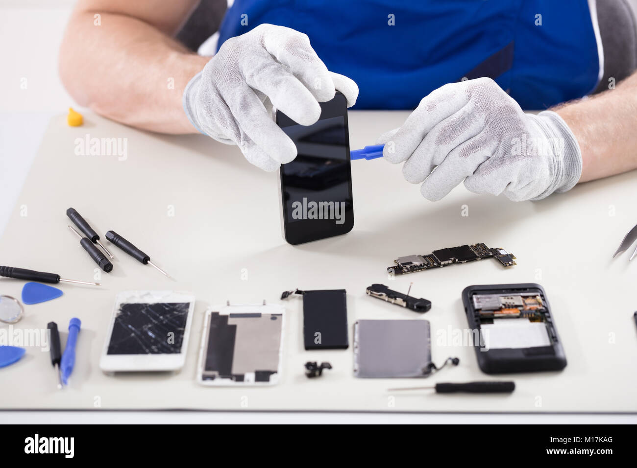 Close-up Of A Human Hand Repairing Smartphone With Screwdriver Stock ...