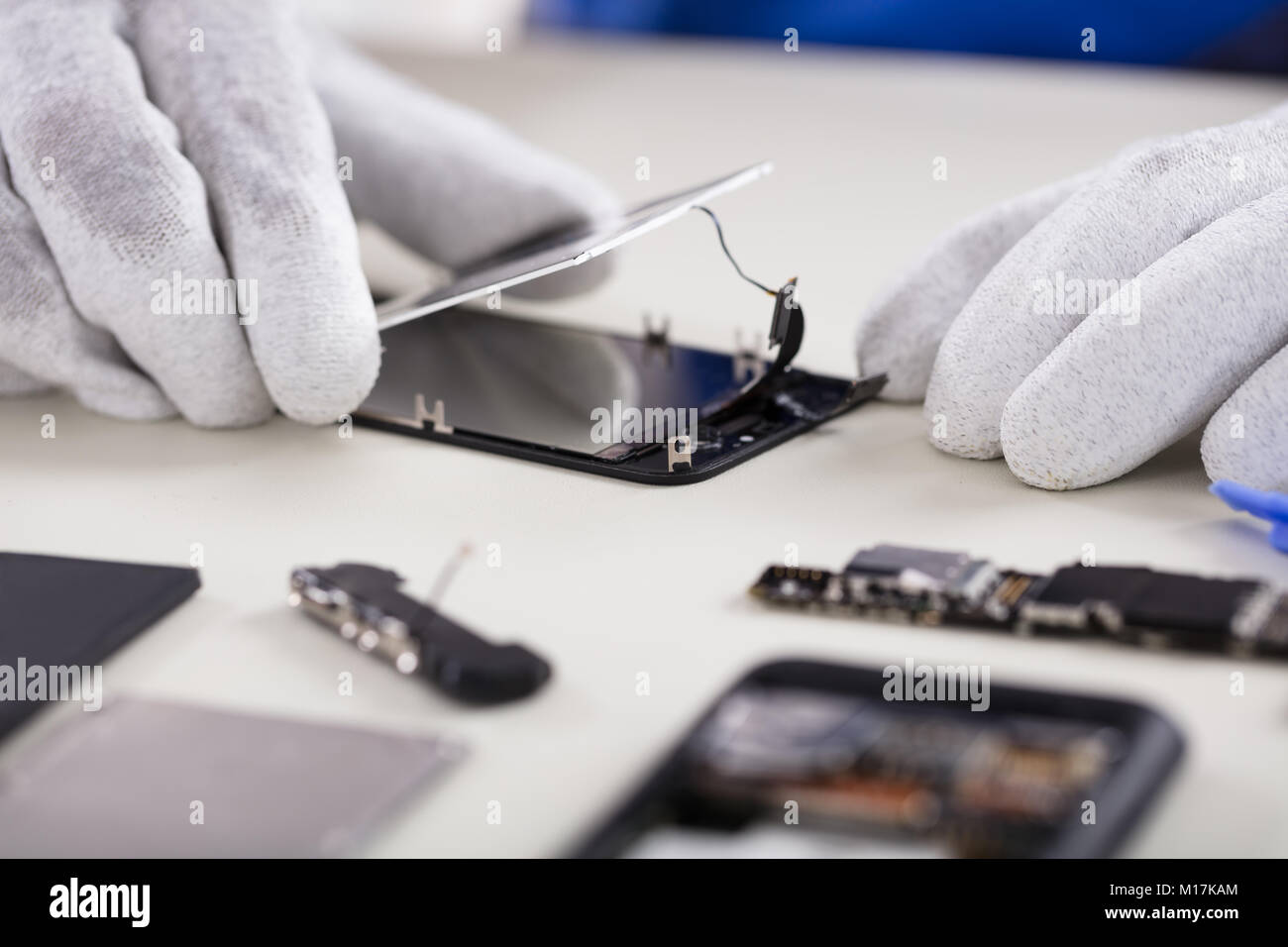 Close-up Of A Person's Hand Wearing Gloves Fixing Damaged Screen Of ...