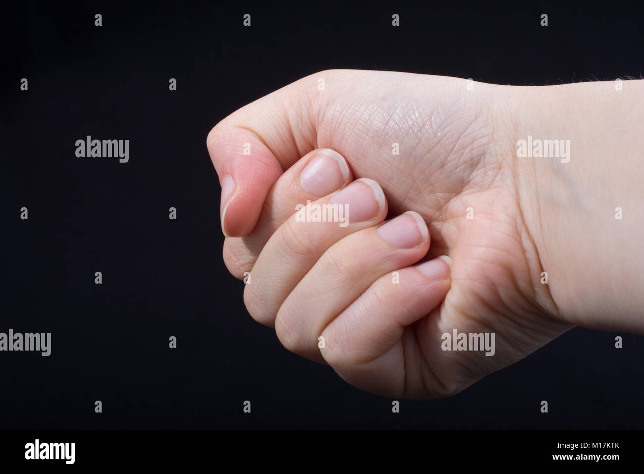 Hand closed for a fist gesture in black Stock Photo - Alamy