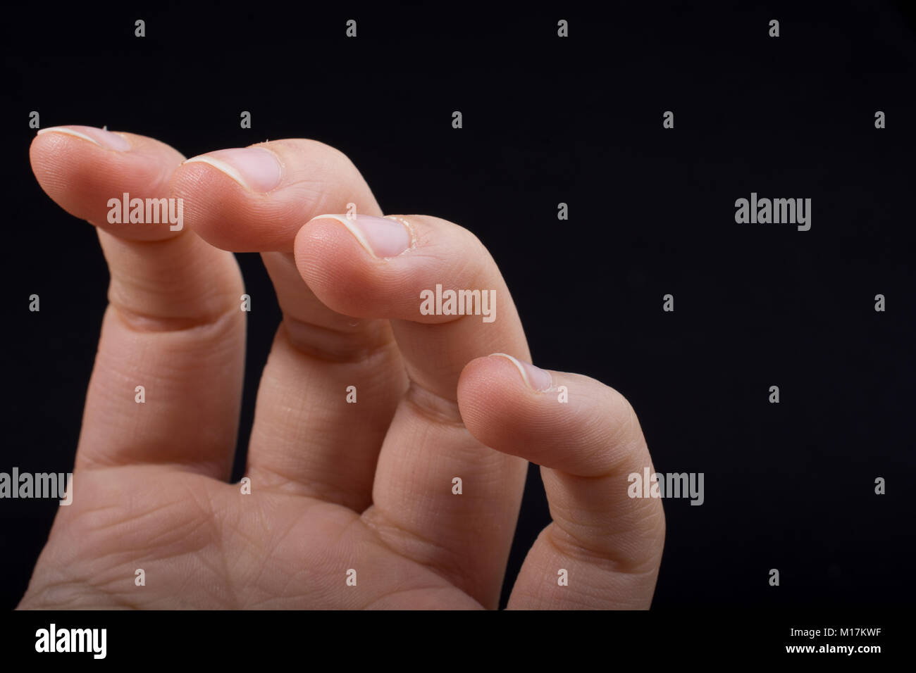 Four fingers of a child hand partly seen in black background Stock ...