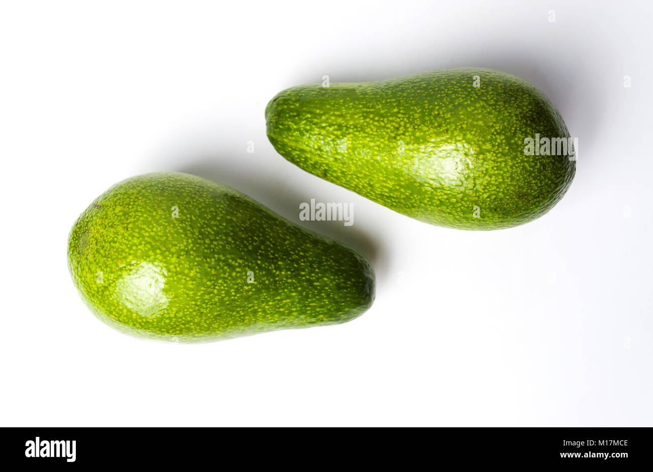 Two avocados isolated on white background. Healthy food Stock Photo - Alamy