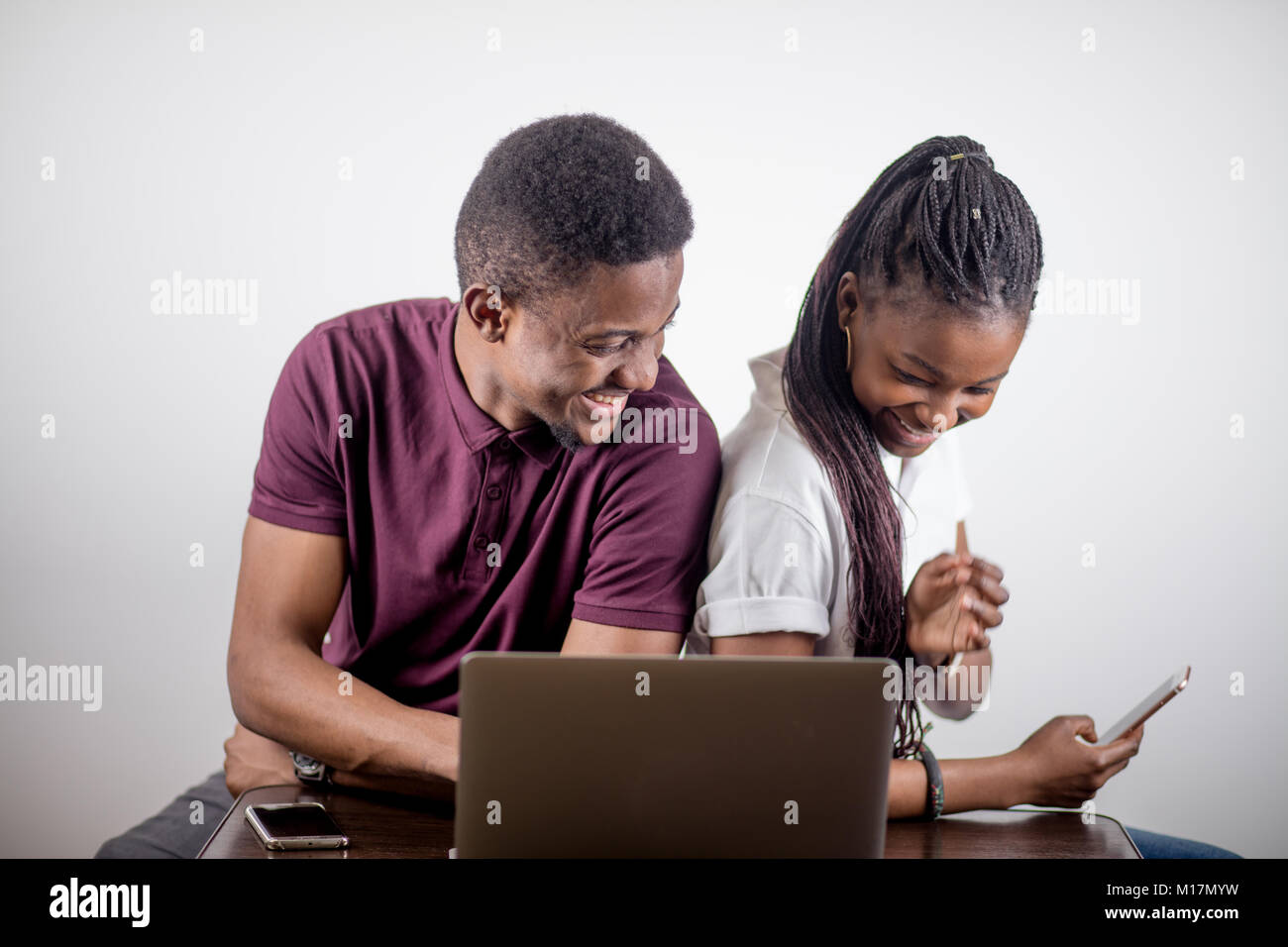 black girl sitting in front of laptop s looking on screen Stock Photo ...