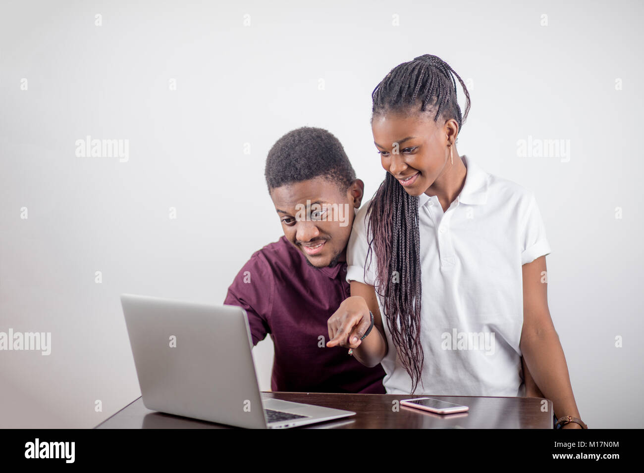 black girl sitting in front of laptop s looking on screen Stock Photo ...
