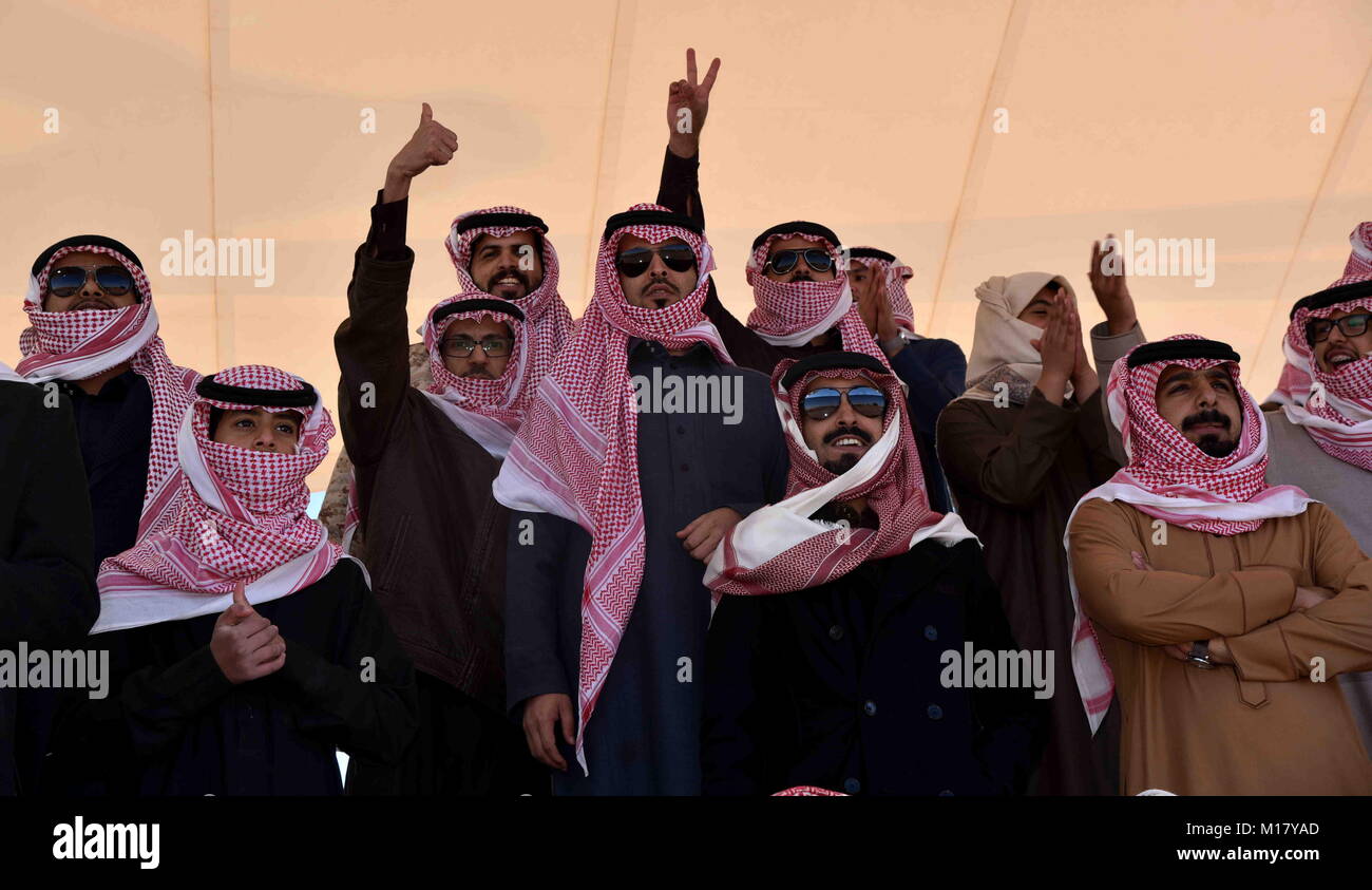 Riyadh, Saudi Arabia. 28th Jan, 2018. Saudi men cheer during a camel ...
