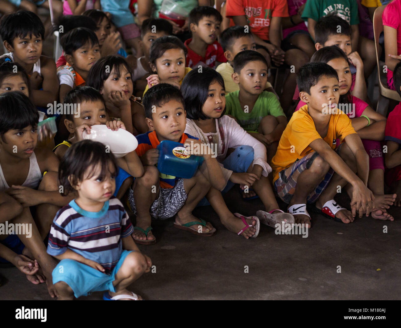 Legazpi, Albay, Philippines. 28th Jan, 2018. Children watch a movie at ...
