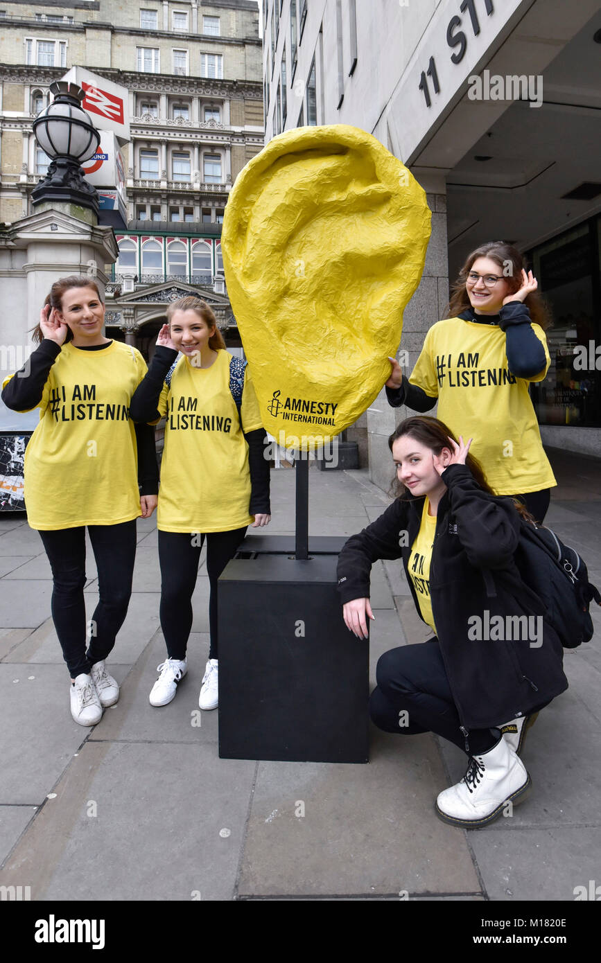 London, UK. 28 January 2018. Amnesty International representatives pose ...