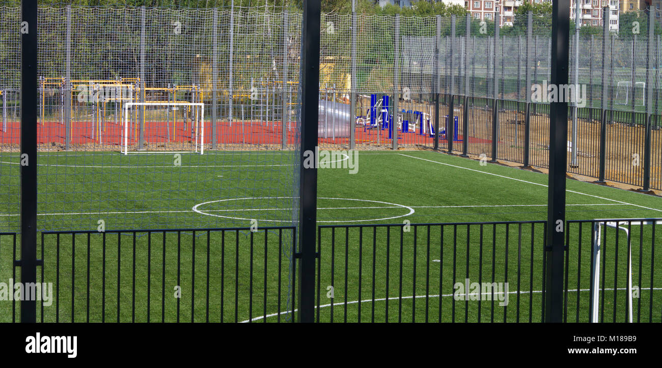 football field near fence at day sunny day Stock Photo - Alamy
