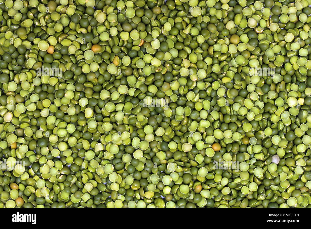 Abstract background texture with dry green peas Stock Photo - Alamy