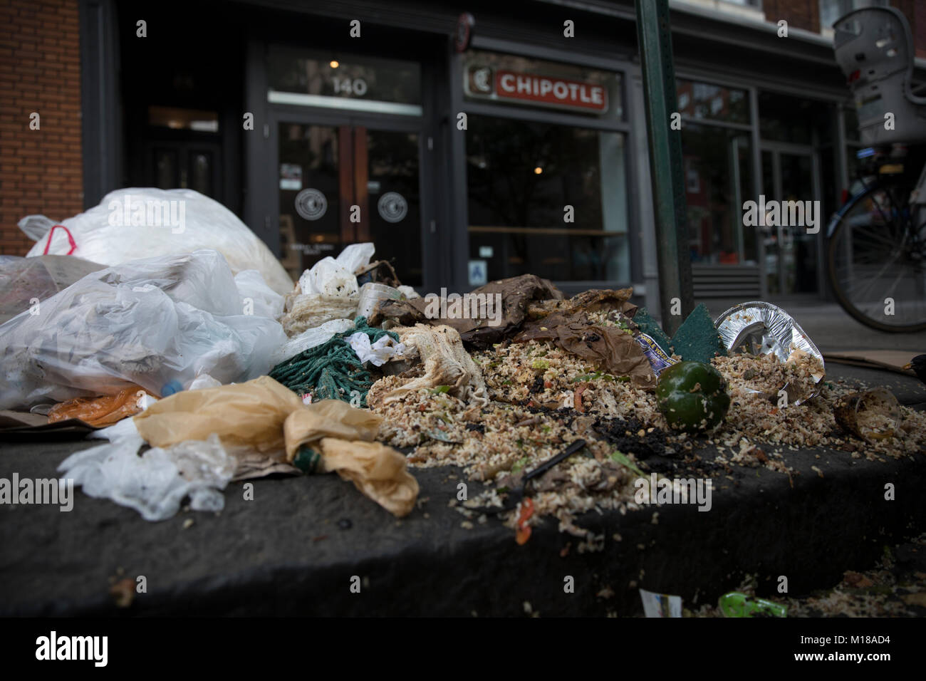 Garbage ripped open by rats sits in front of Chipotle's restaurant in ...