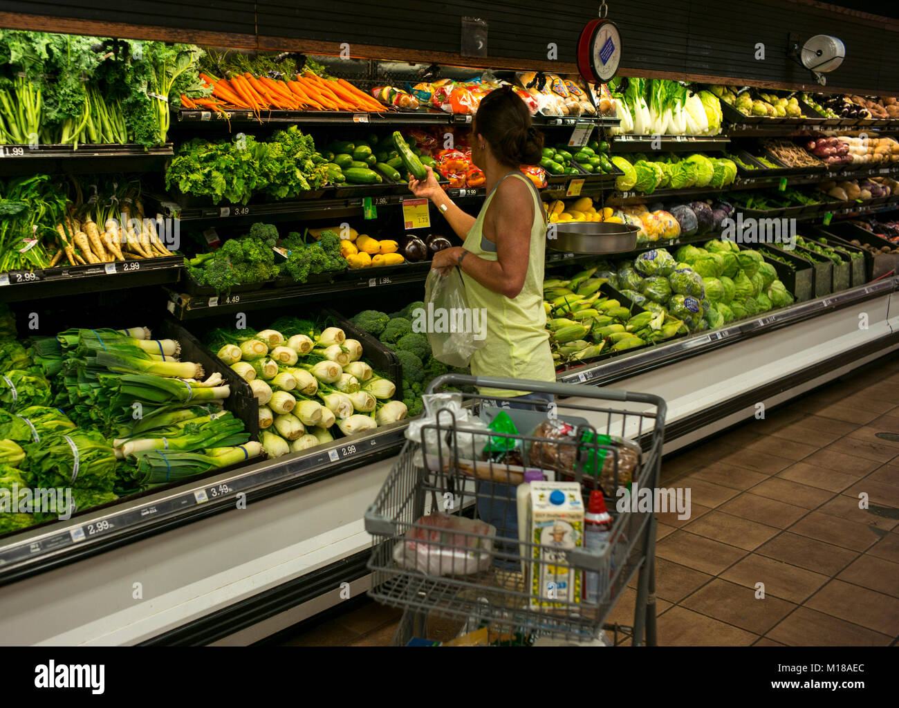 A woman shops for fresh vegetables at a Price Chopper supermarket in ...