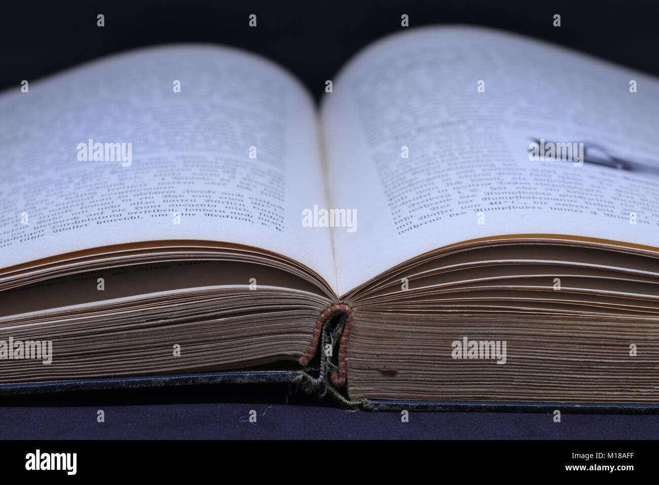 Old open book Stock Photo - Alamy