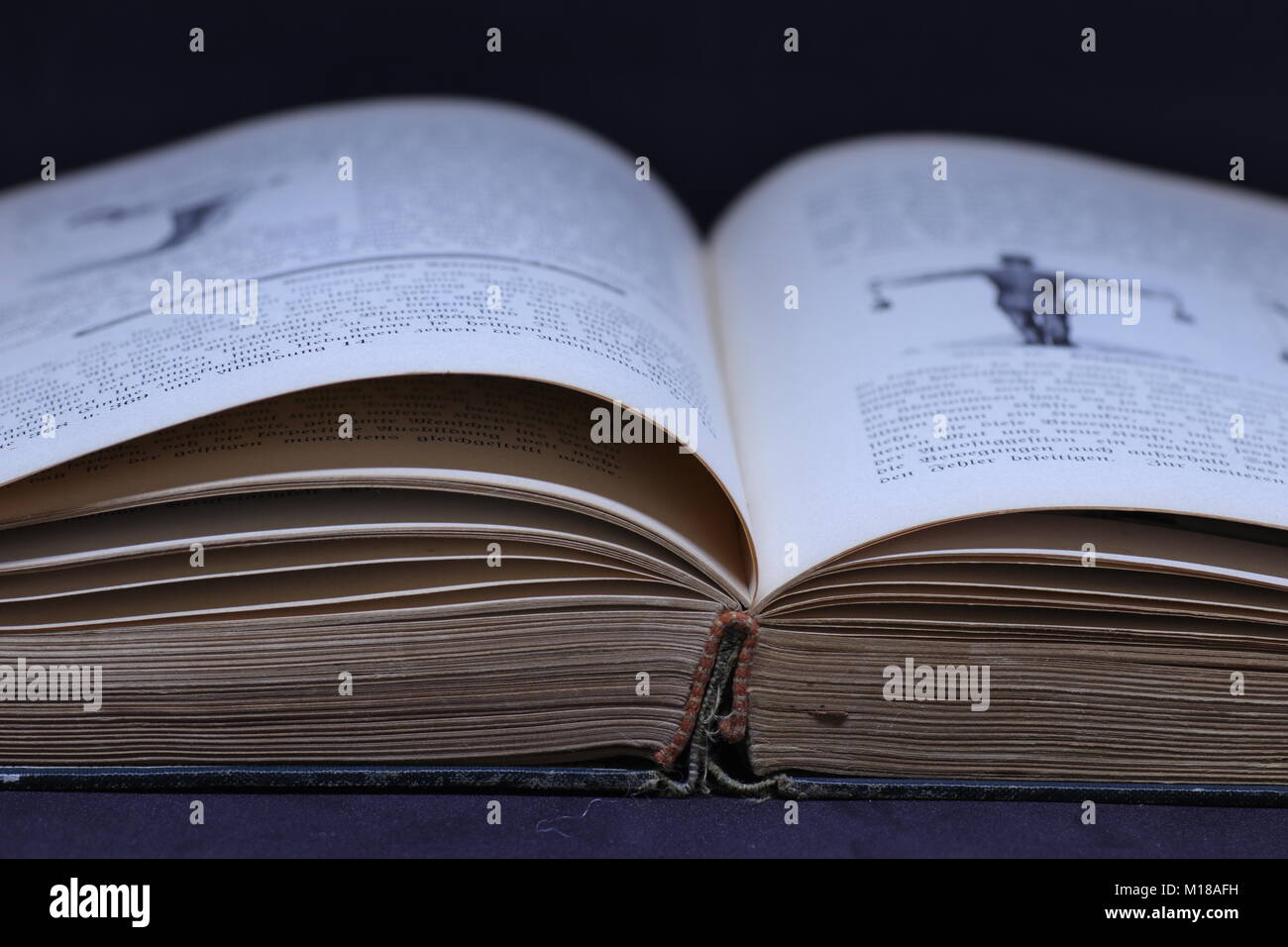 Old open book Stock Photo - Alamy