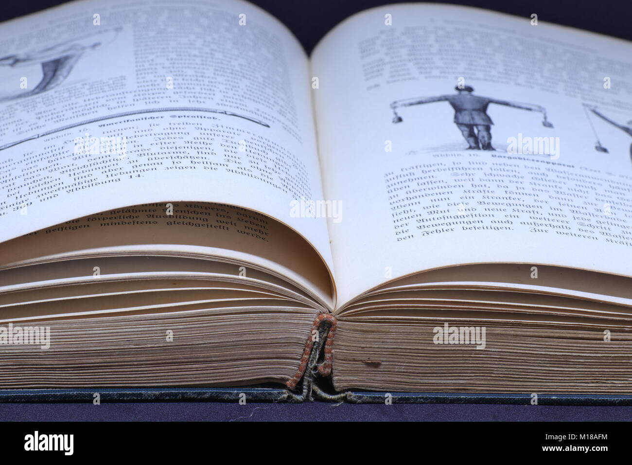 Old open book Stock Photo - Alamy