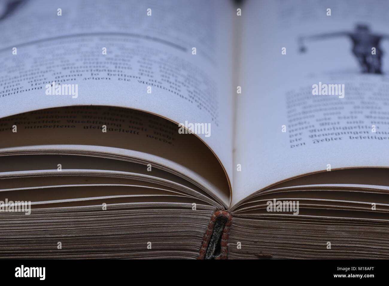 Old open book Stock Photo - Alamy