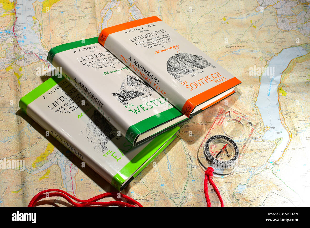 Alfred Wainwright books with compass and OS maps Stock Photo - Alamy