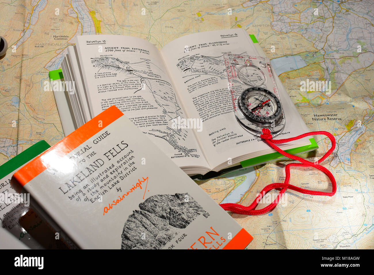 Alfred Wainwright books with compass and OS maps Stock Photo - Alamy