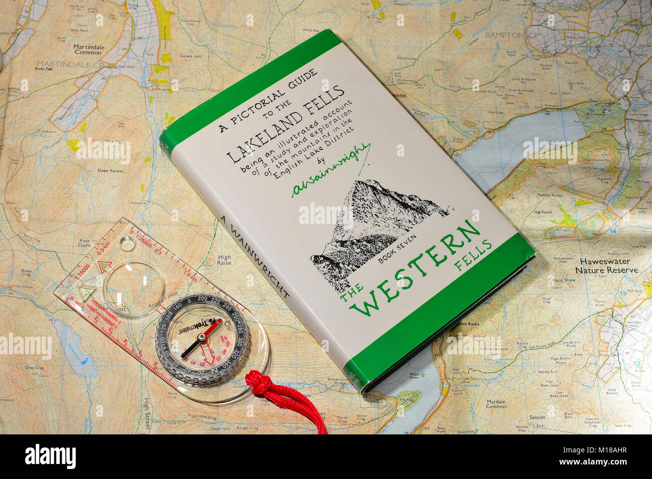 Alfred Wainwright books with compass and OS maps Stock Photo - Alamy
