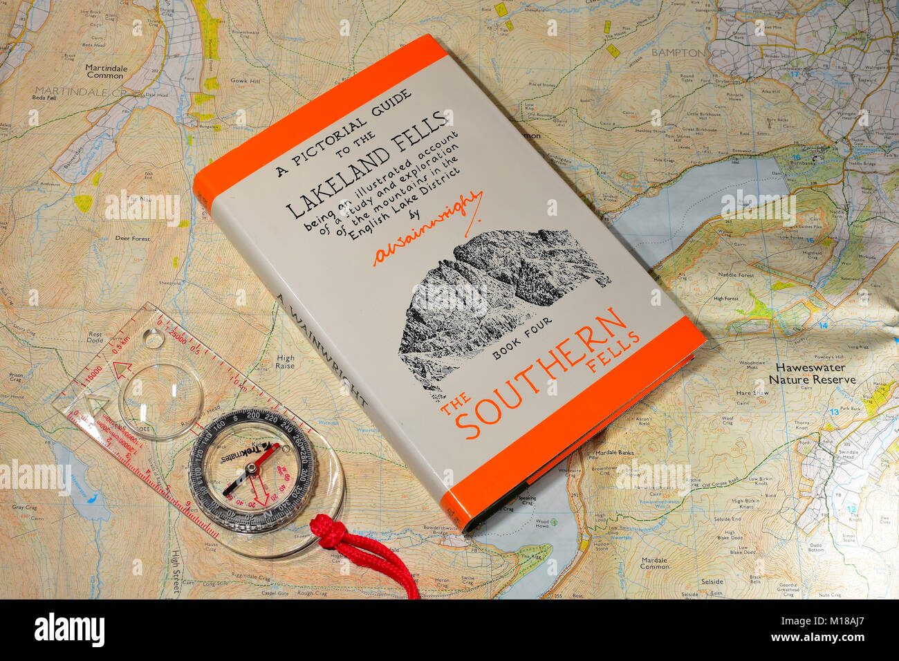 Alfred Wainwright books with compass and OS maps Stock Photo - Alamy