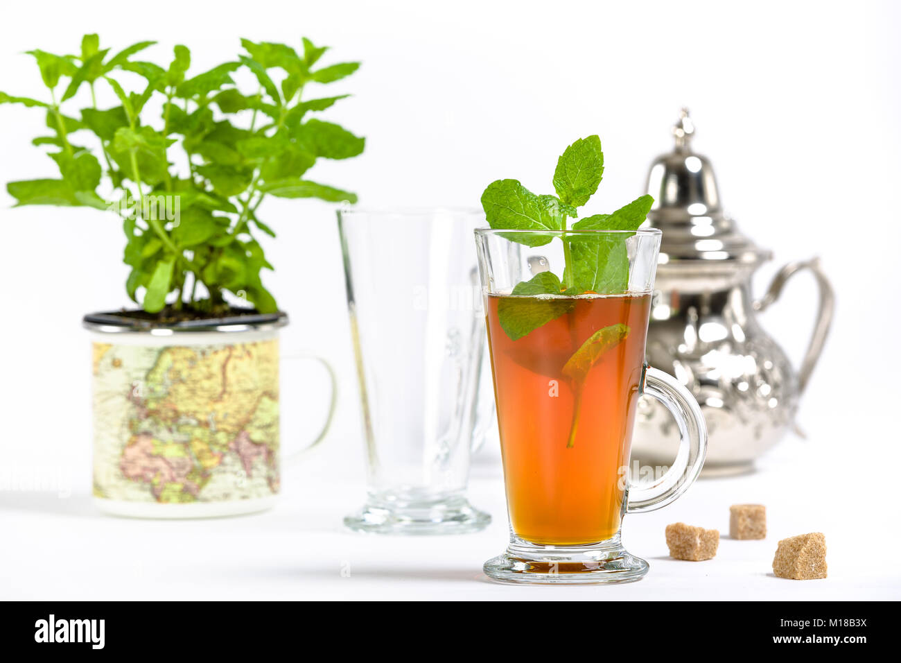 Traditional refreshing Arab mint tea. Isolated on the white background ...