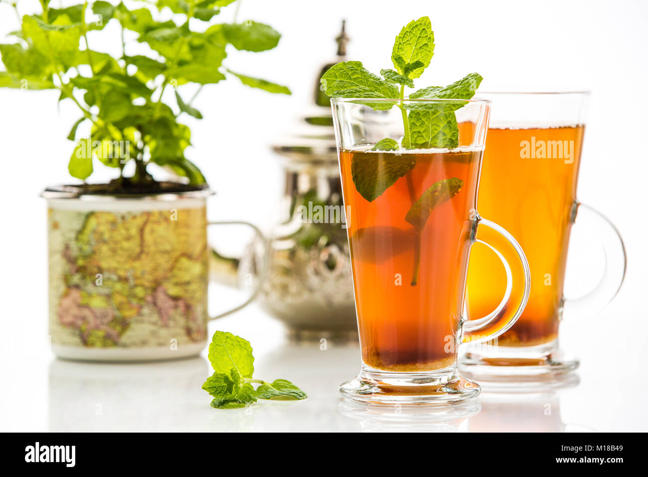 Traditional refreshing Arab mint tea. Isolated on the white background ...