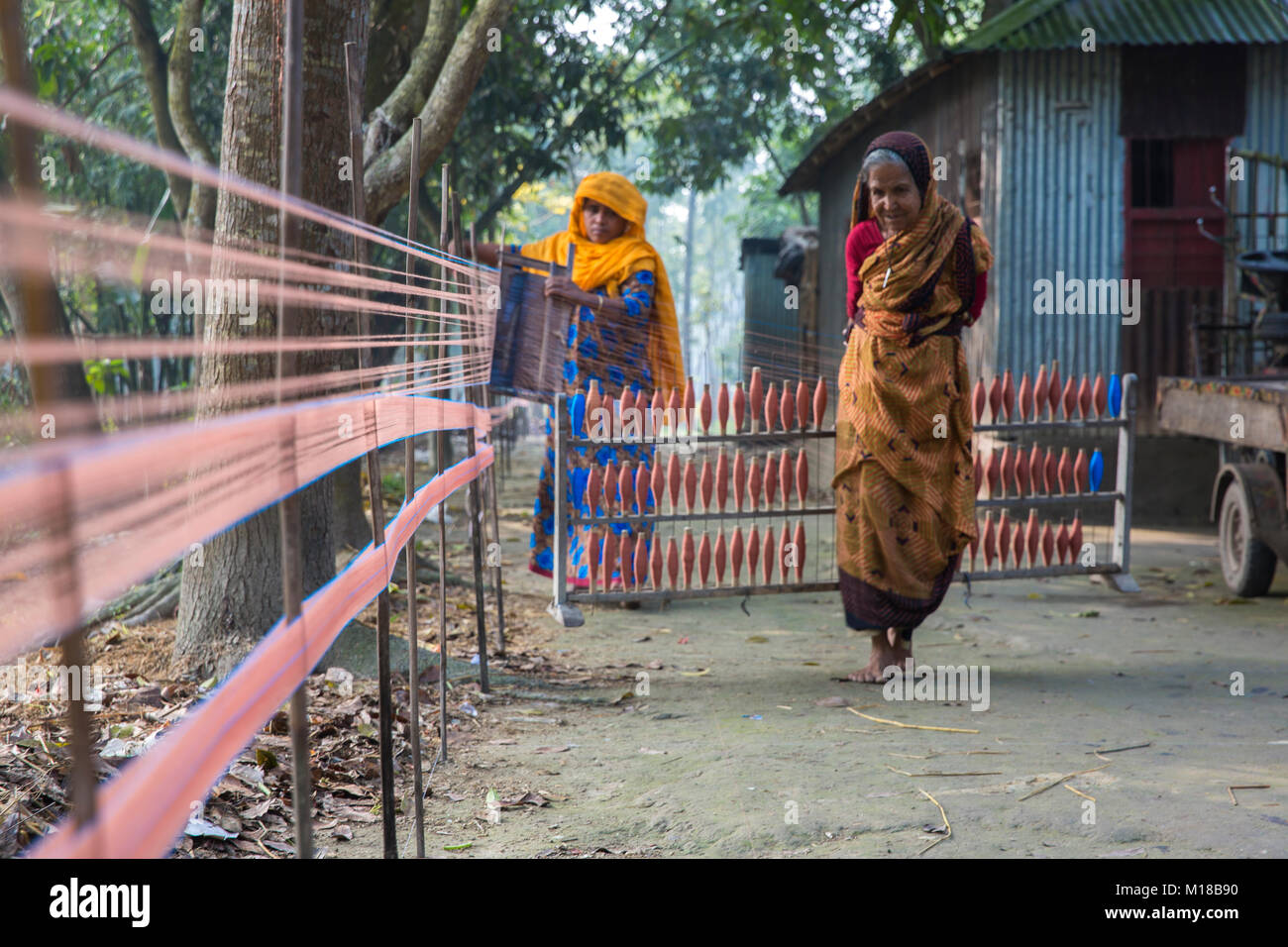 Bangladesh – December 18, 2017: An village old lady and other weaver ...