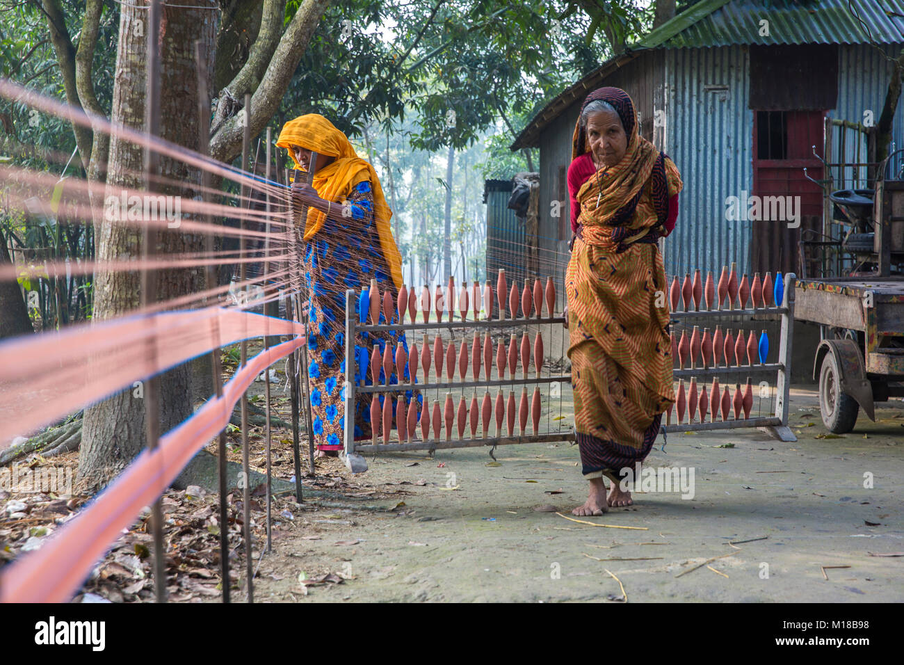 Bangladesh – December 18, 2017: An village old lady and other weaver ...
