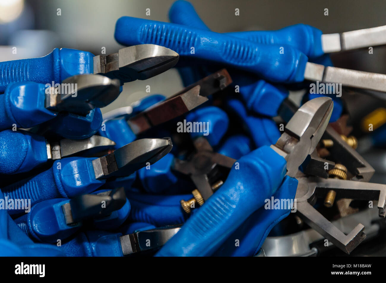 Pile of blue pincers, pliers and other tools Stock Photo - Alamy