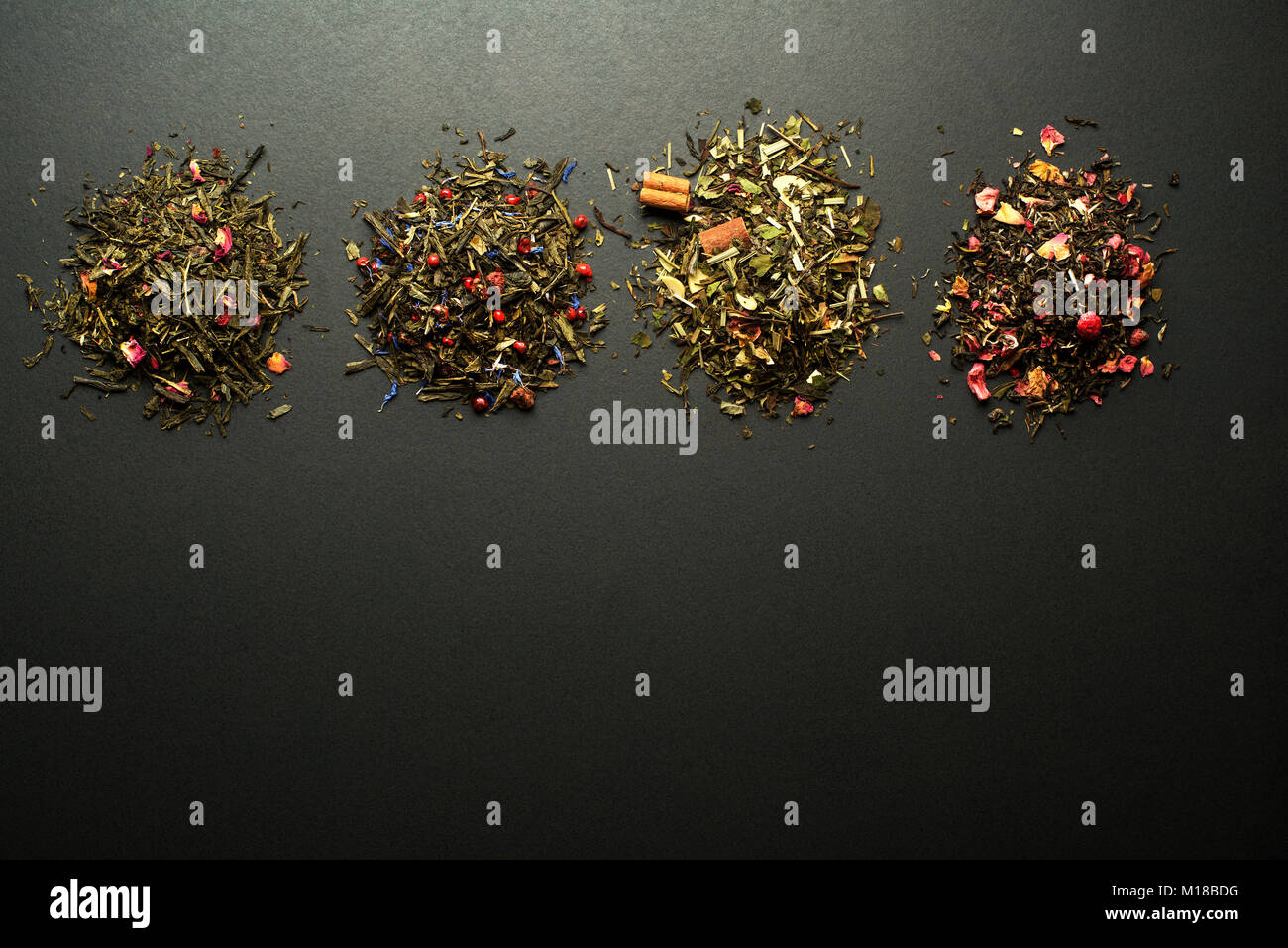 Dry tea collection of different types on black background Stock Photo ...