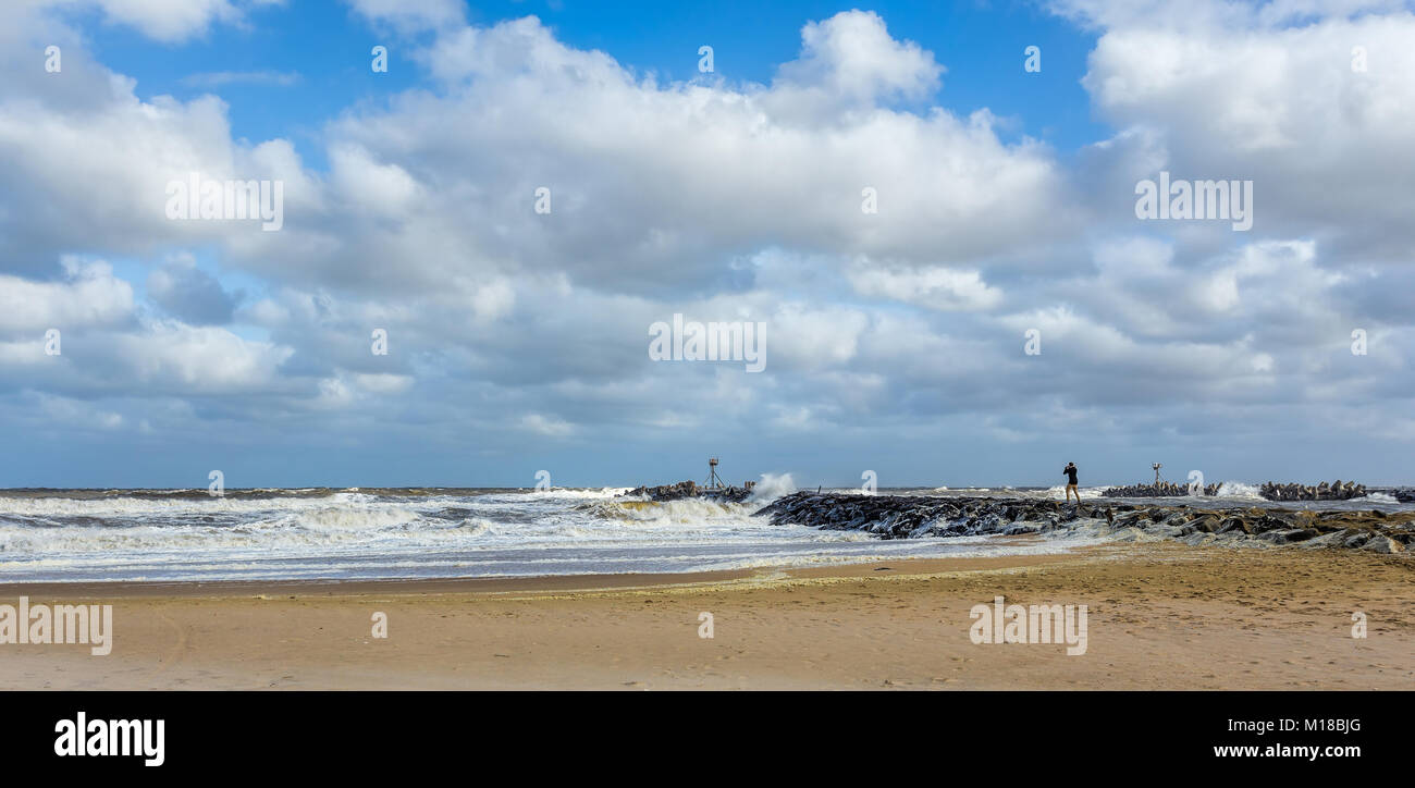 The New Jersey shore at Manasquan Inlet. The ocean is rough as there is ...