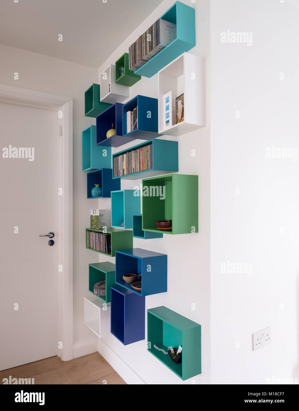Colorful display units painted in blue and green ombre colours, hanging ...