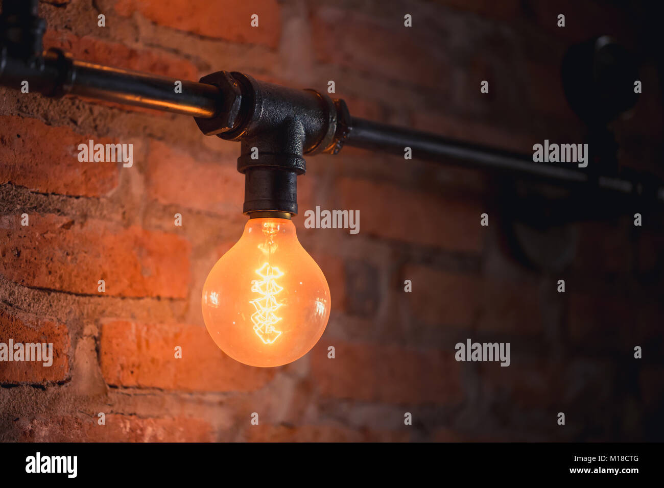 vintage light bulb on brick wall loft style cafe lighting decoration ...