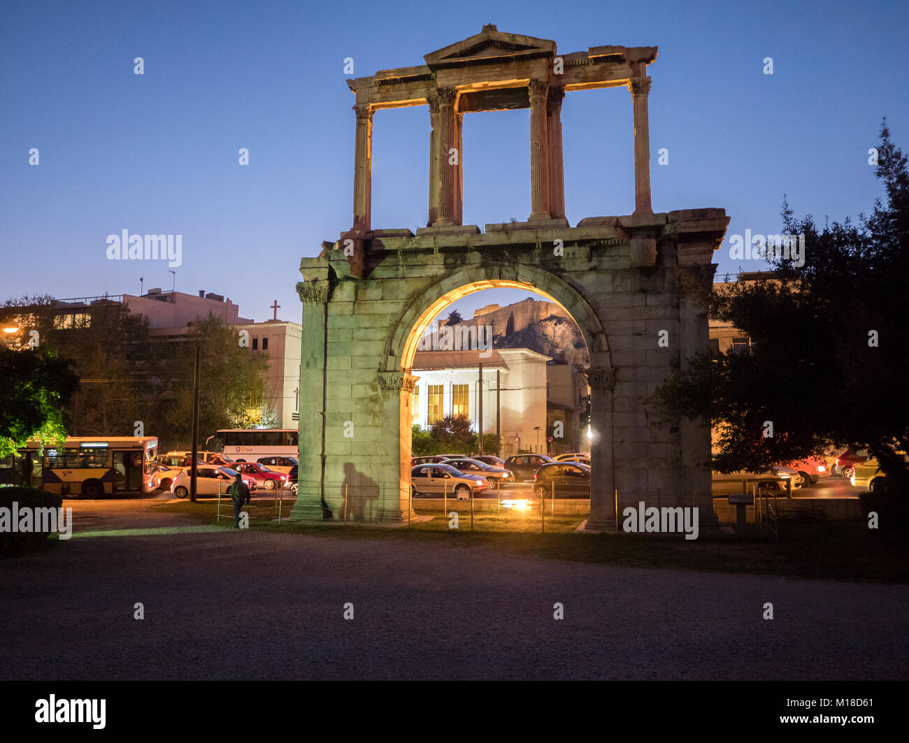 Hadrian's gate illuminated at night with Acropolis on the background in ...