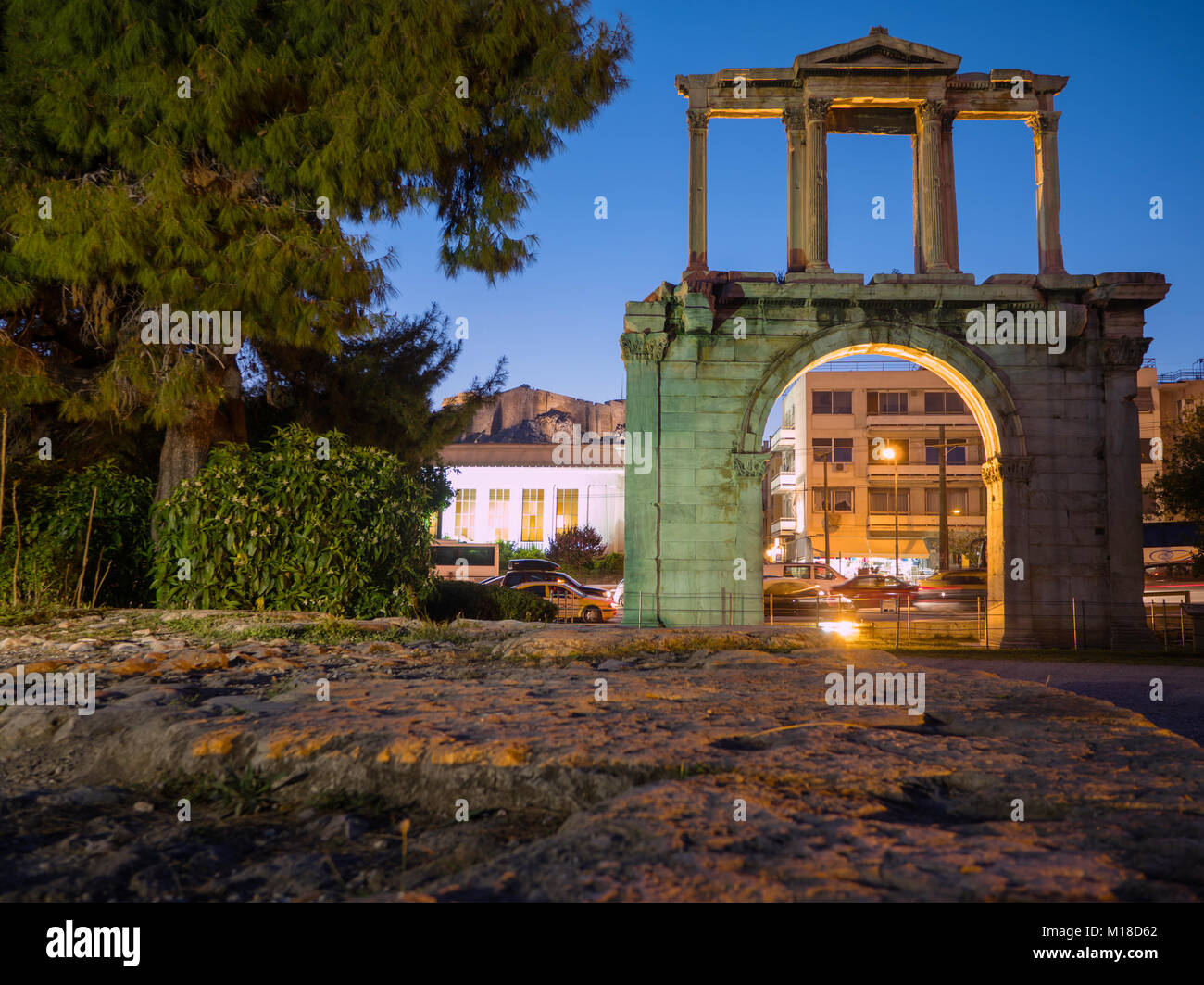 Hadrian's gate illuminated at night with Acropolis on the background in ...