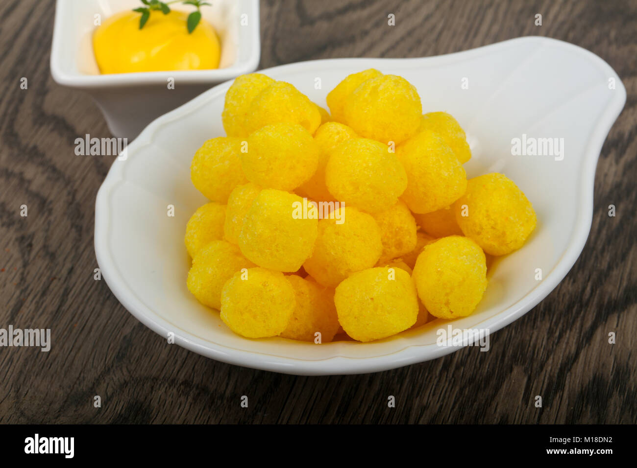 Cheese corn balls with sauce Stock Photo - Alamy