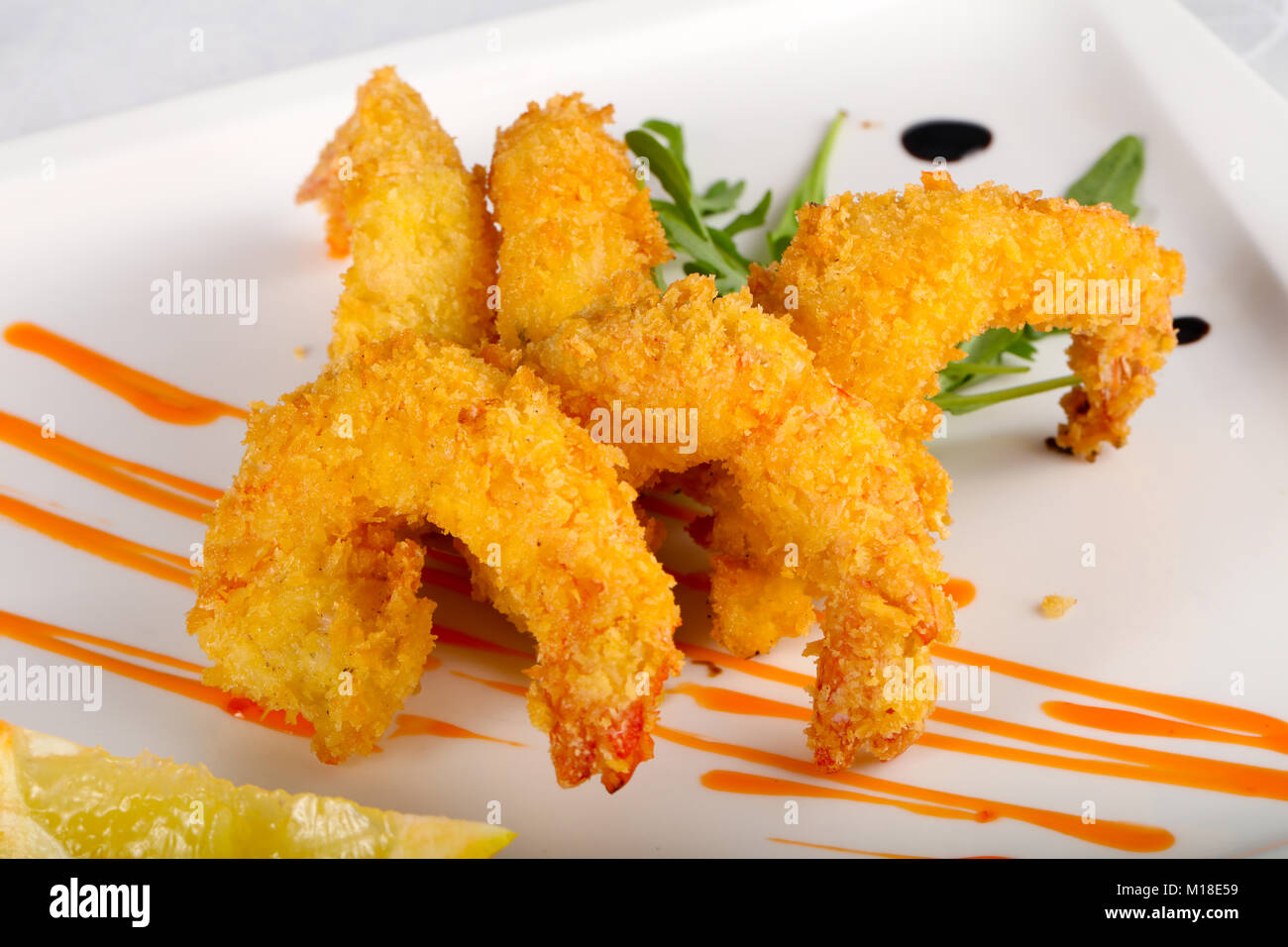 Crispy prawns served lemon slice Stock Photo - Alamy