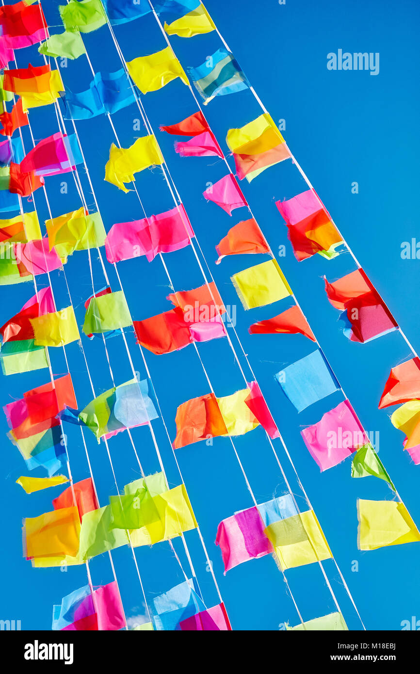 Colorful flags against the blue sky Stock Photo - Alamy