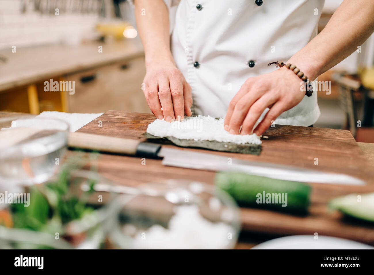 Sushi preparation process, traditional japanese food. Male cook making ...
