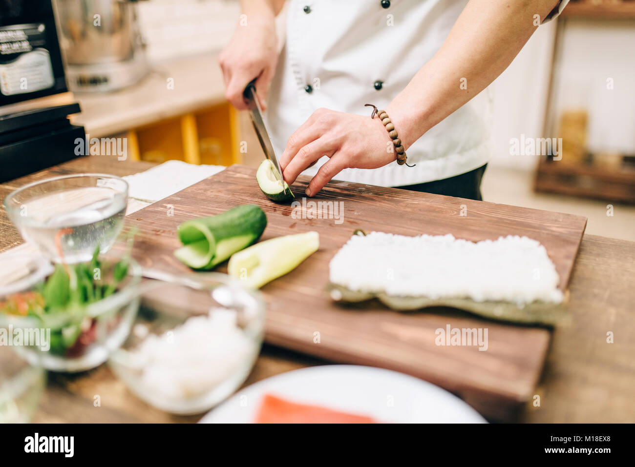 Sushi preparation process, traditional japanese cuisine. Male cook ...