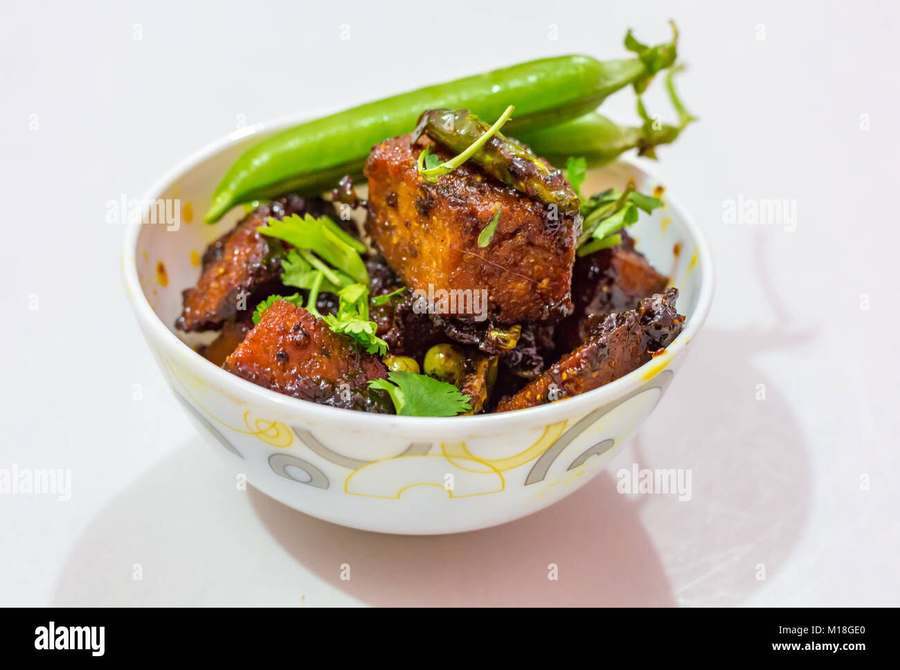 Traditional Bengali Indian dish known as Dhokar Dalna made from crushed ...