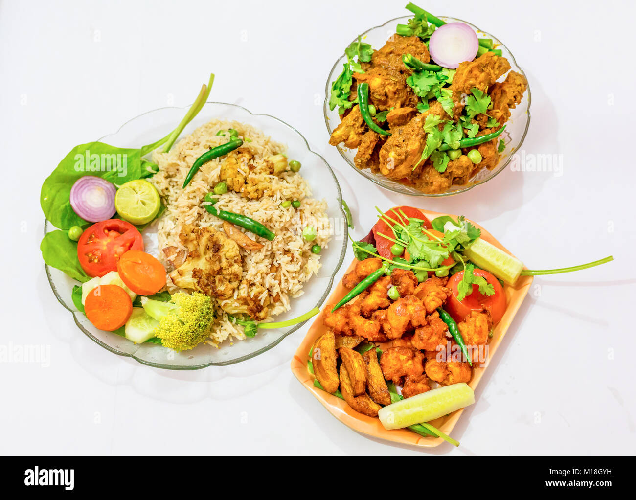 Indian cuisine dishes veg fried rice and spicy chicken kosha isolated ...