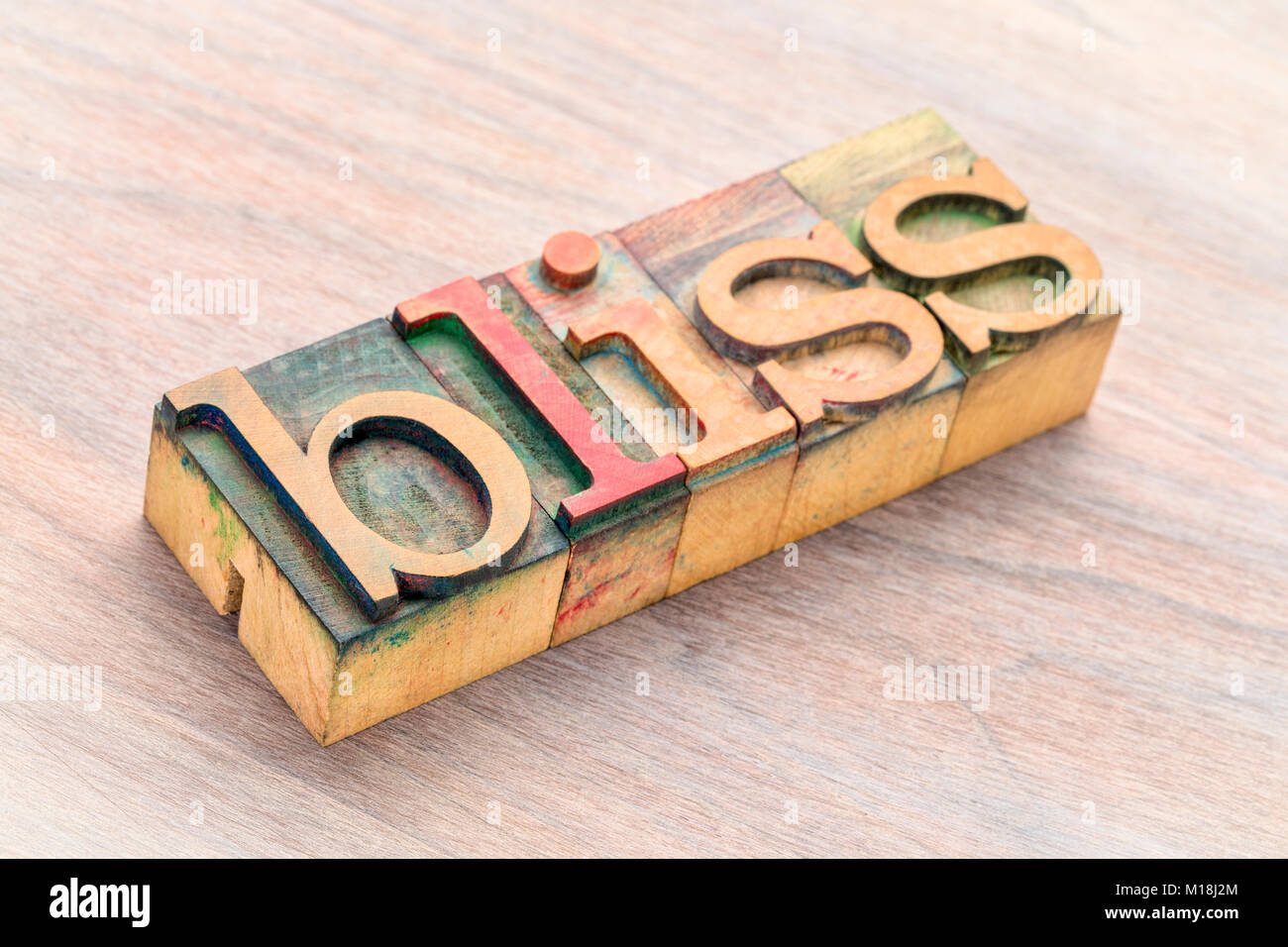 bliss word abstract in letterpress wood type blocks stained by color ...