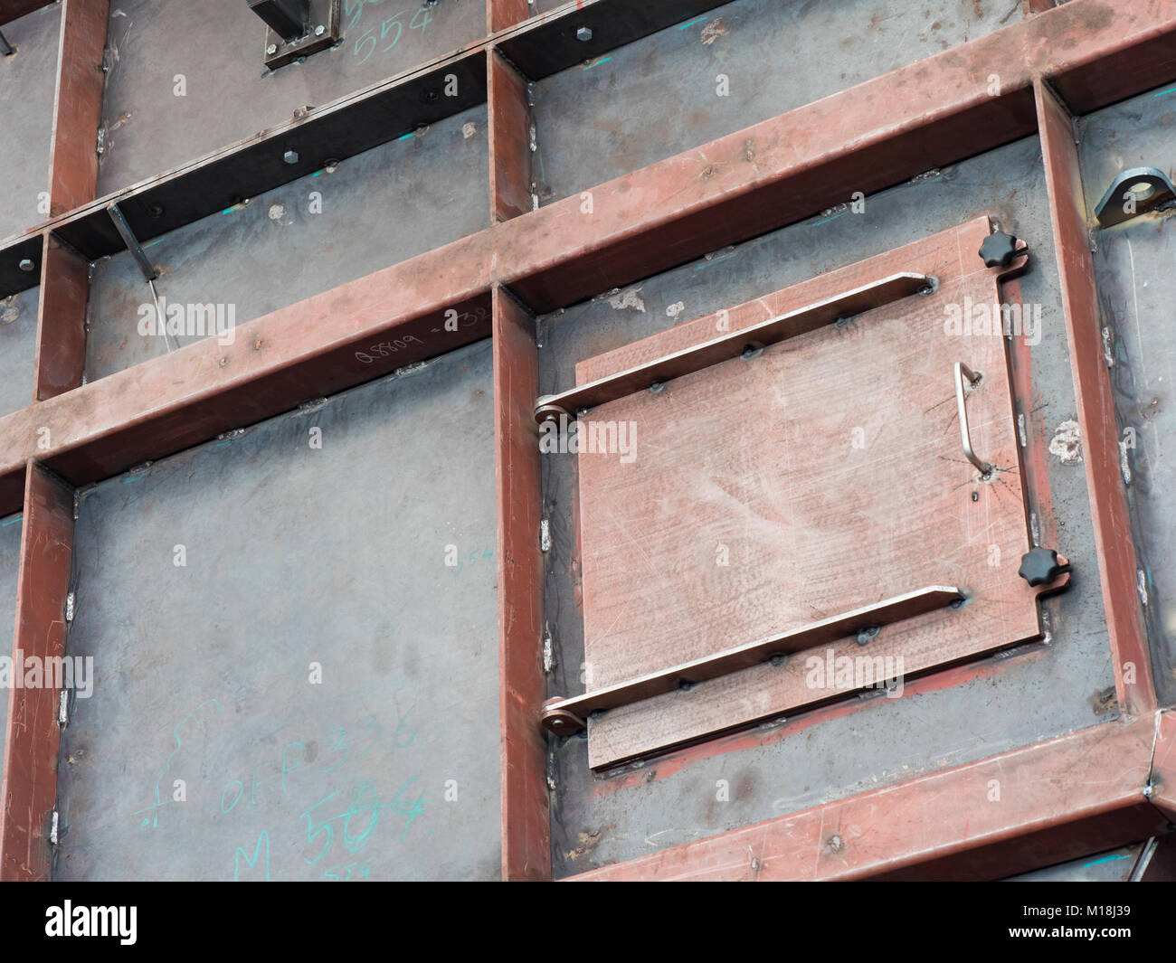 Large steel tank with inspection door under construction Stock Photo ...