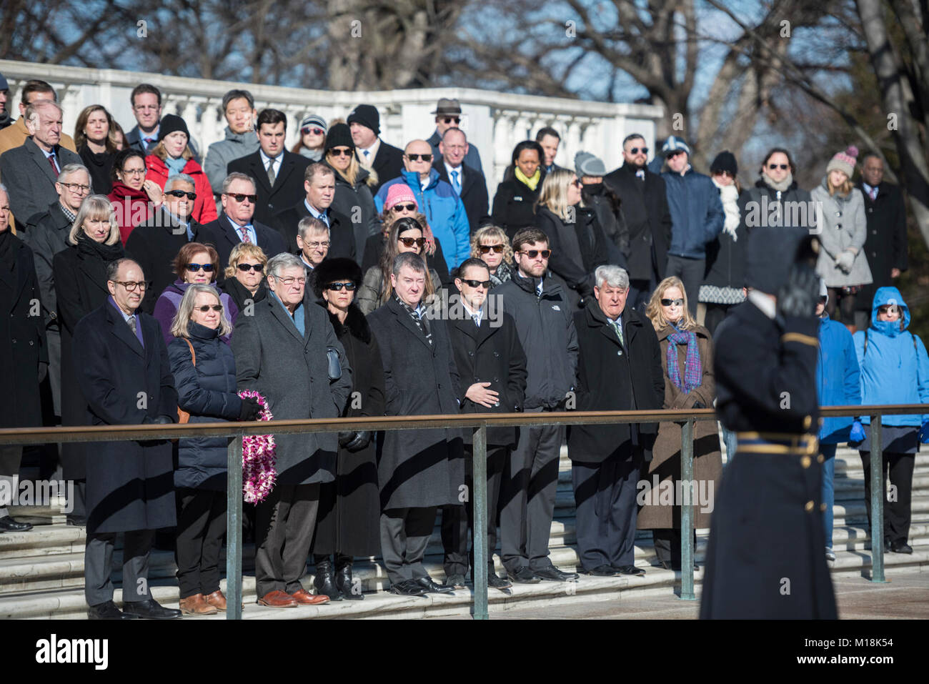 NASA employees, families and friends observe a wreath-laying ceremony ...