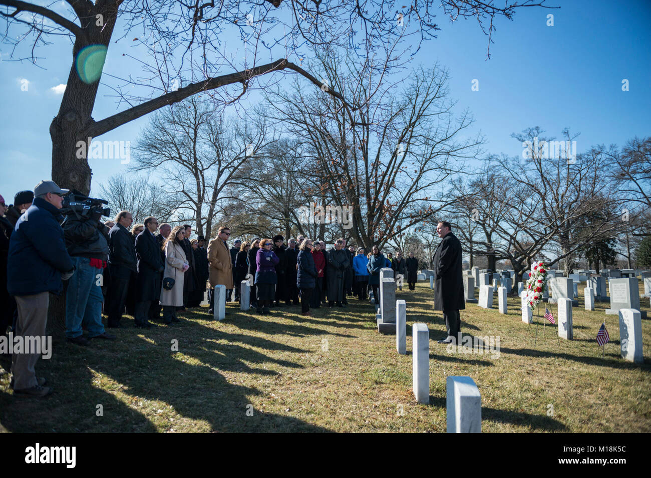 NASA employees, families and friends listen as Robert Lightfoot (right ...