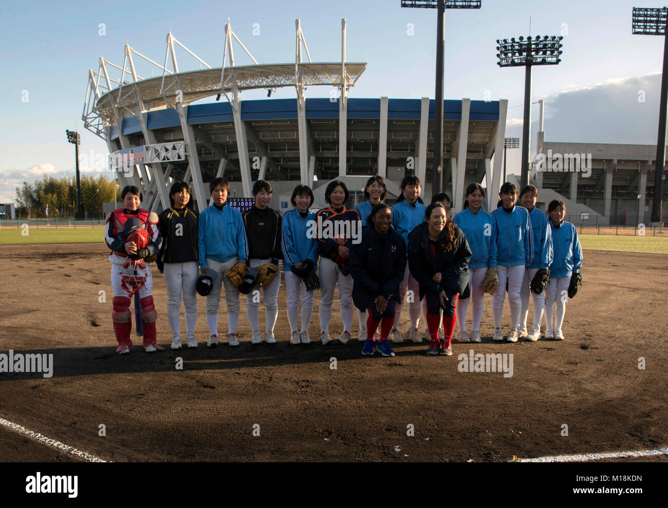 Players from the Higashi Middle School softball team pose with members ...