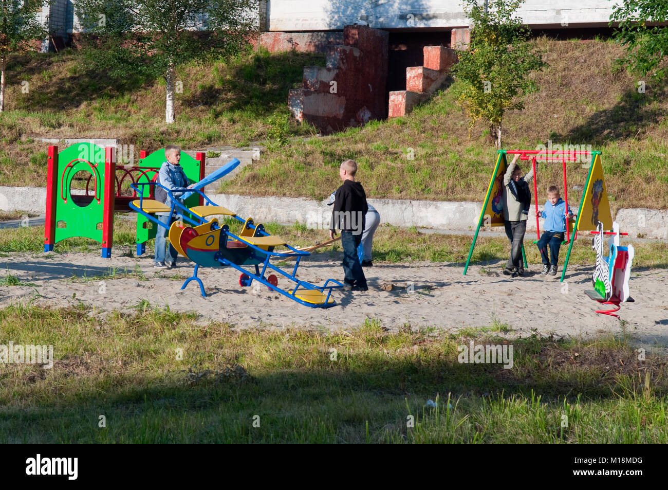 Children playing in the street playground Stock Photo - Alamy