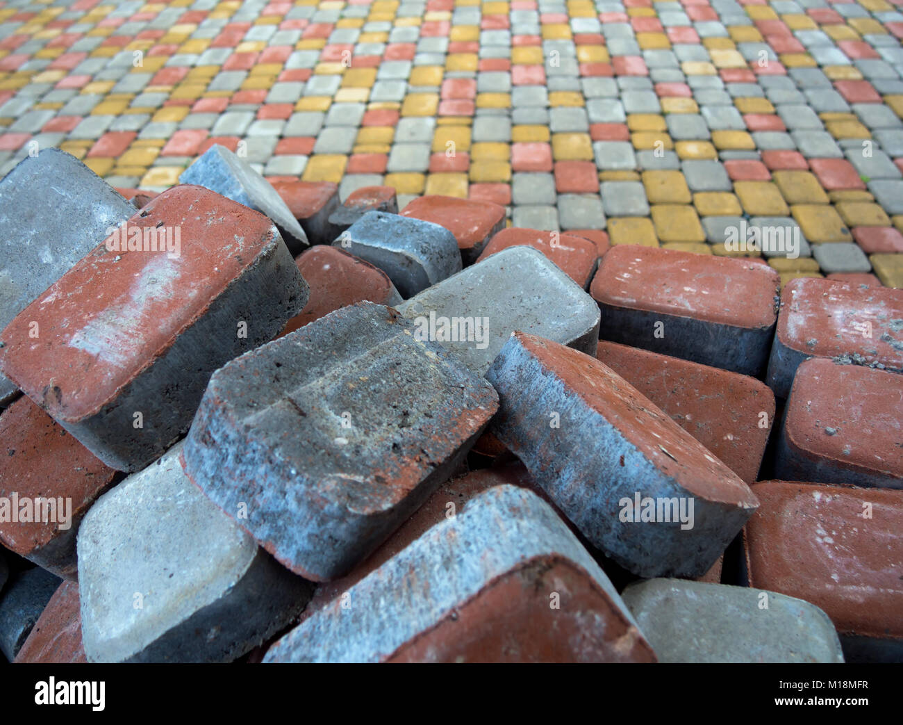 The use of multi-colored blocks for paving sidewalks Stock Photo - Alamy